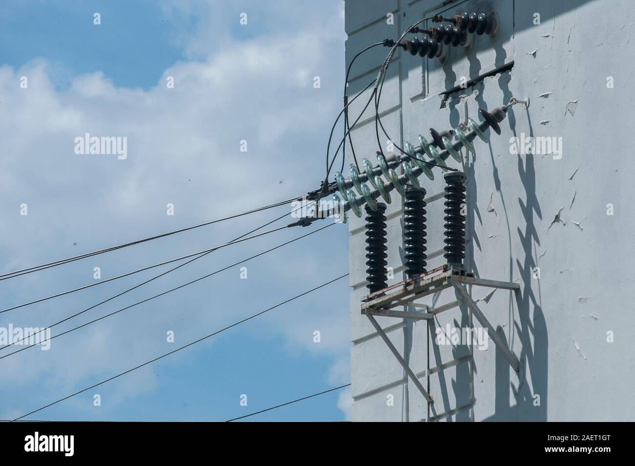 High voltage electric cables closeup on power station wall Stock Photo ...