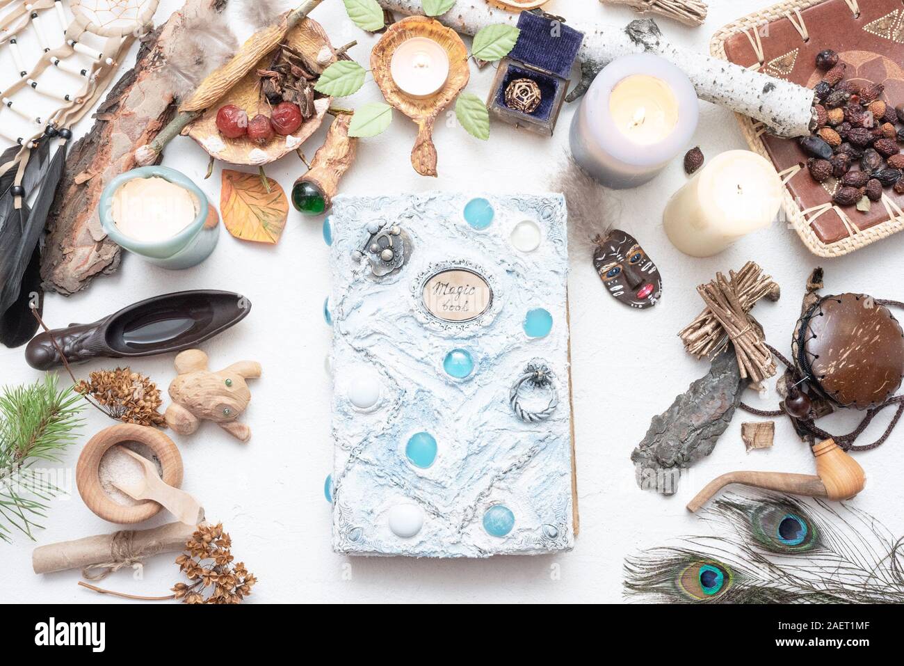 Magic book on witch doctor table background concept Stock Photo - Alamy