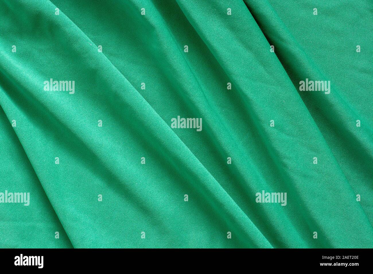 Green fabric texture with beautiful waves. Diagonal waves. Thin soft ...