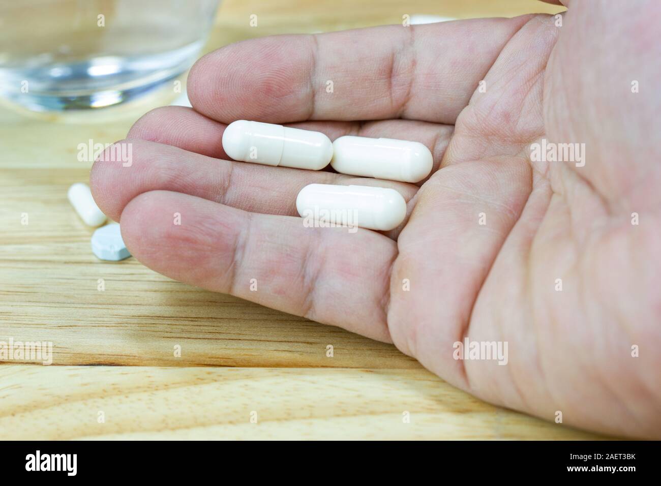 The many pill and capsules in hand man, concept healthcare Stock Photo ...
