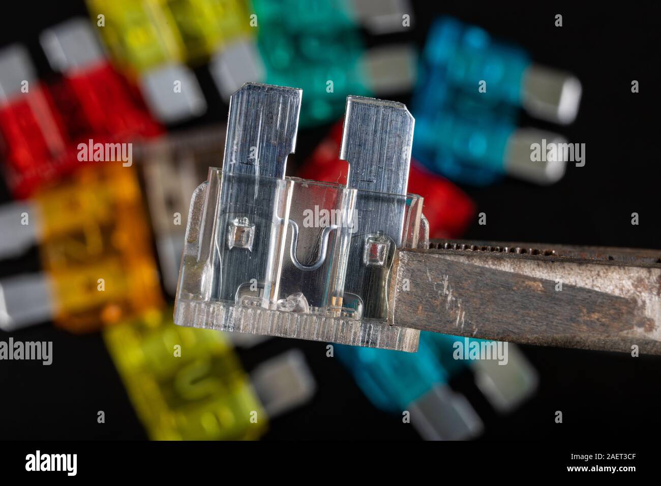 Car fuses on the black table. Car accessories needed to repair the ...