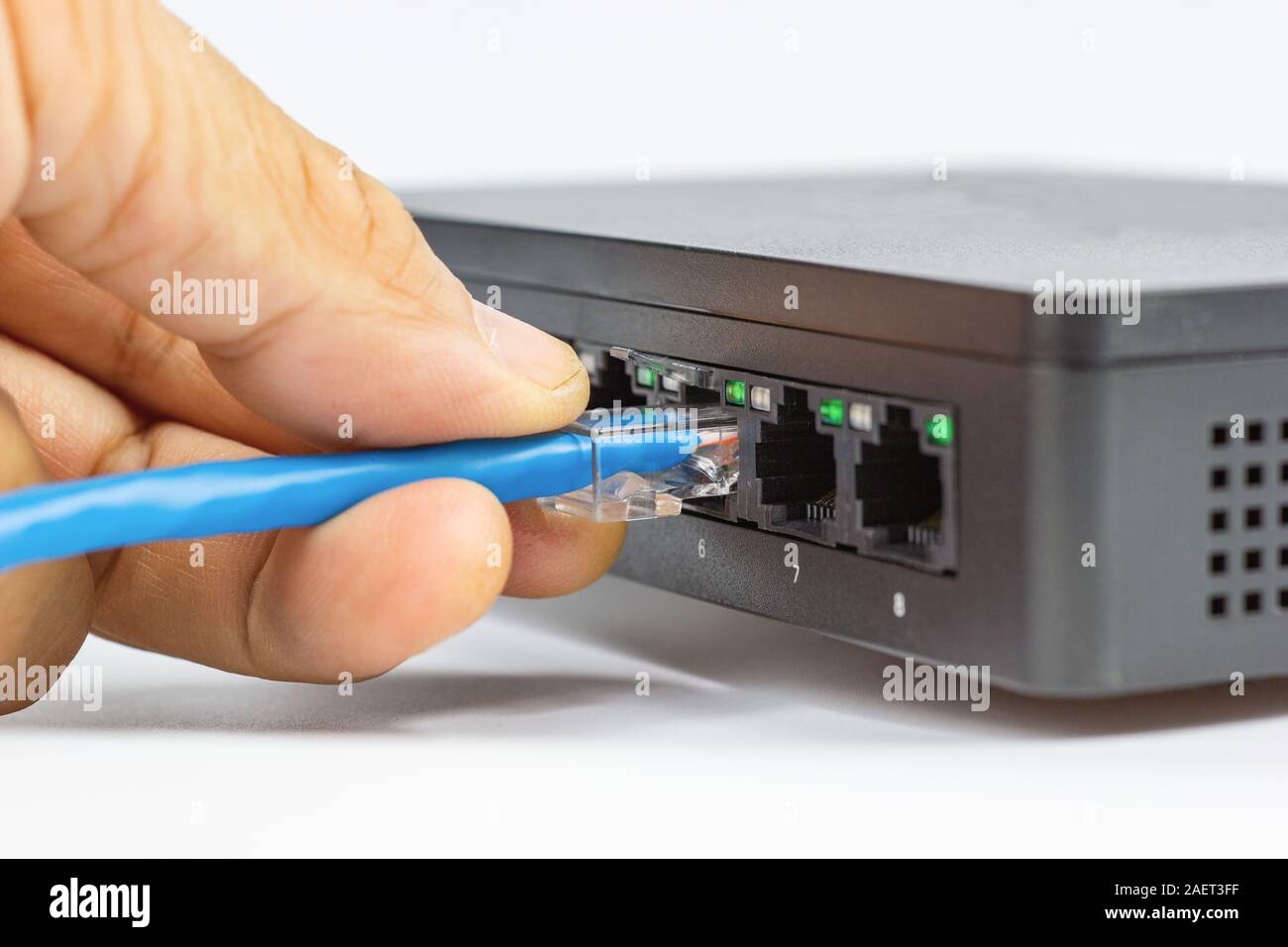 Hand of man holding The network cables to connect Lan port, concept ...