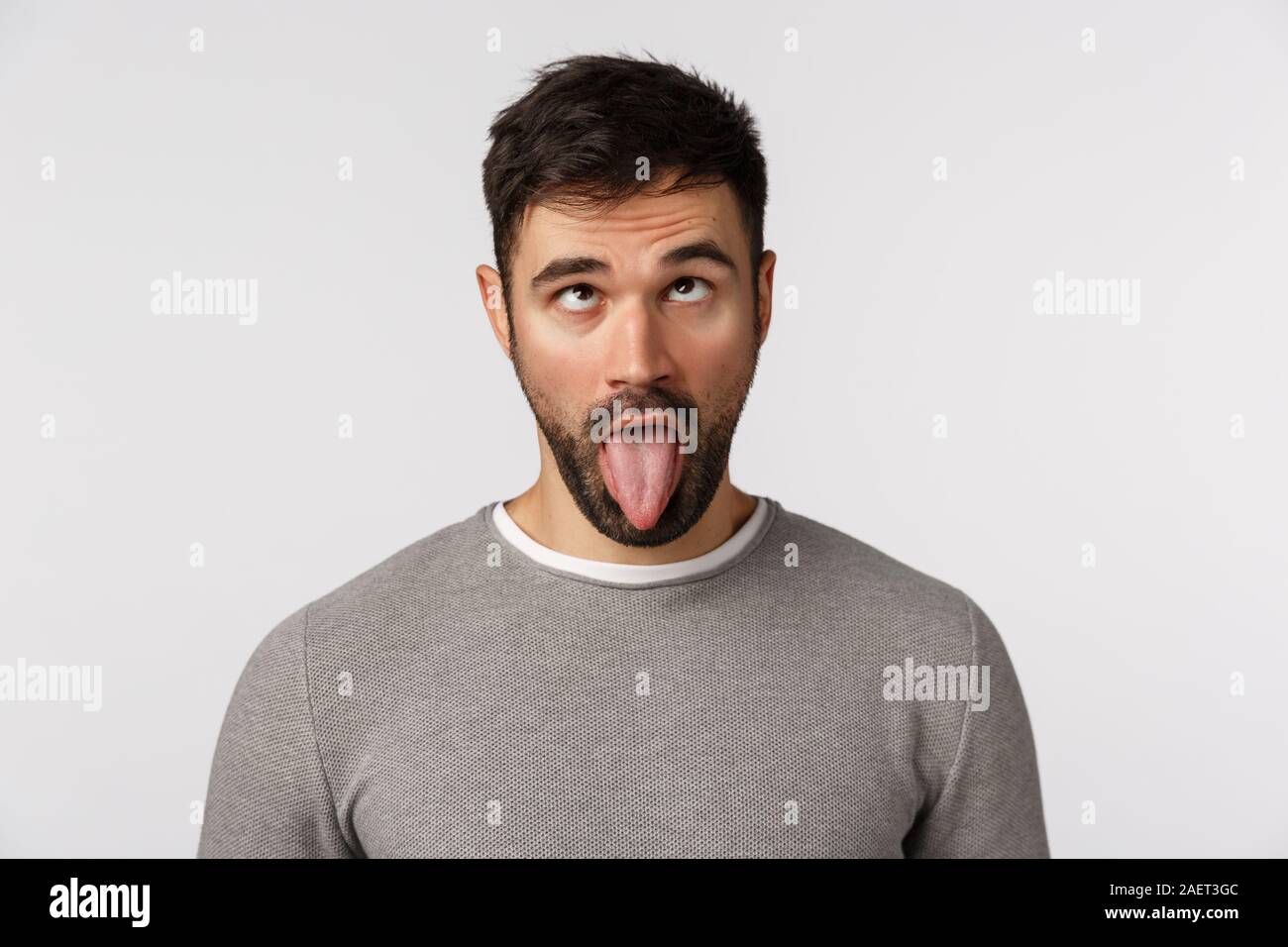 Close-up studio shot funny bearded guy going crazy home-sick home ...