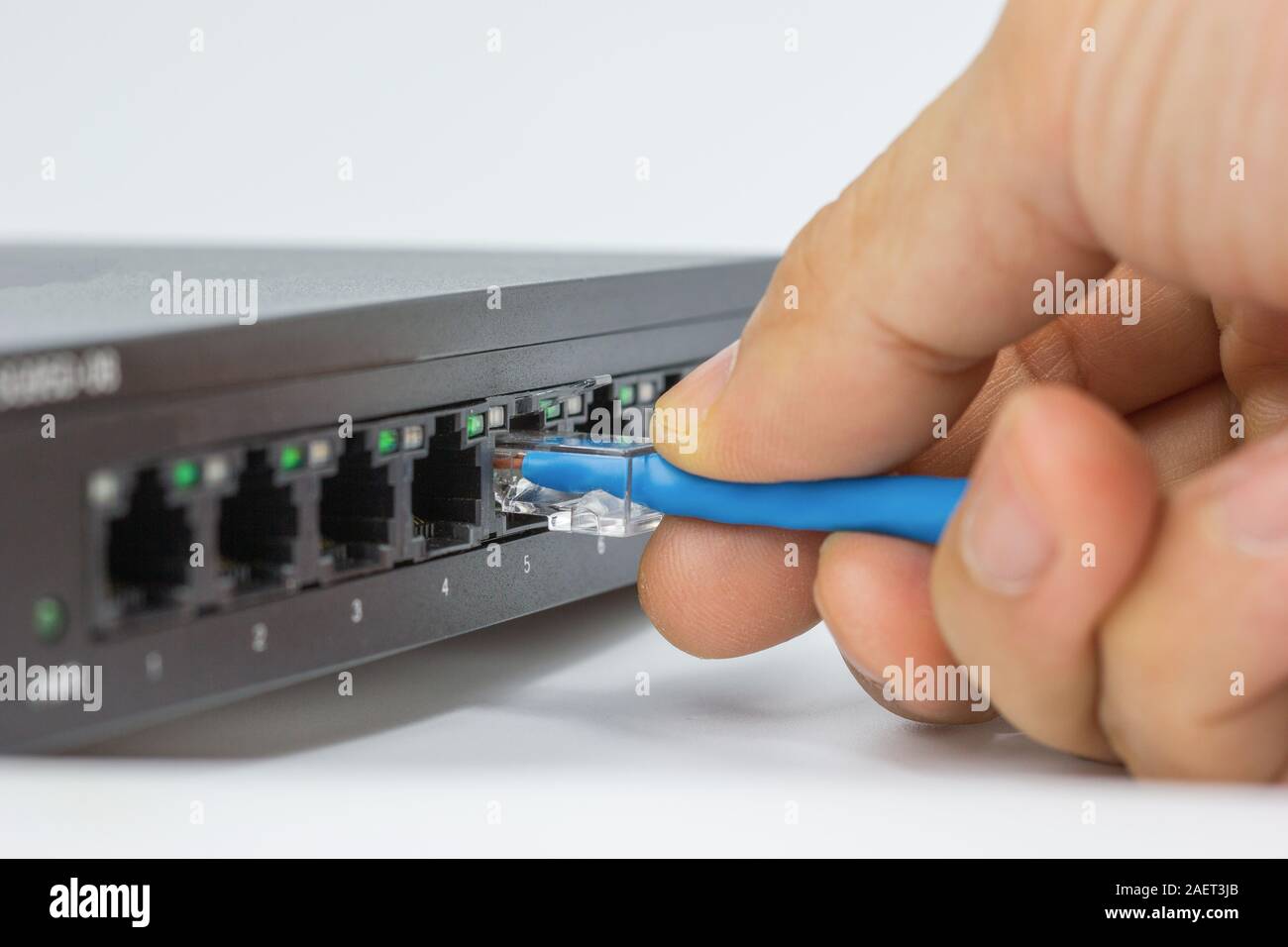 Hand of man holding The network cables to connect Lan port, concept ...