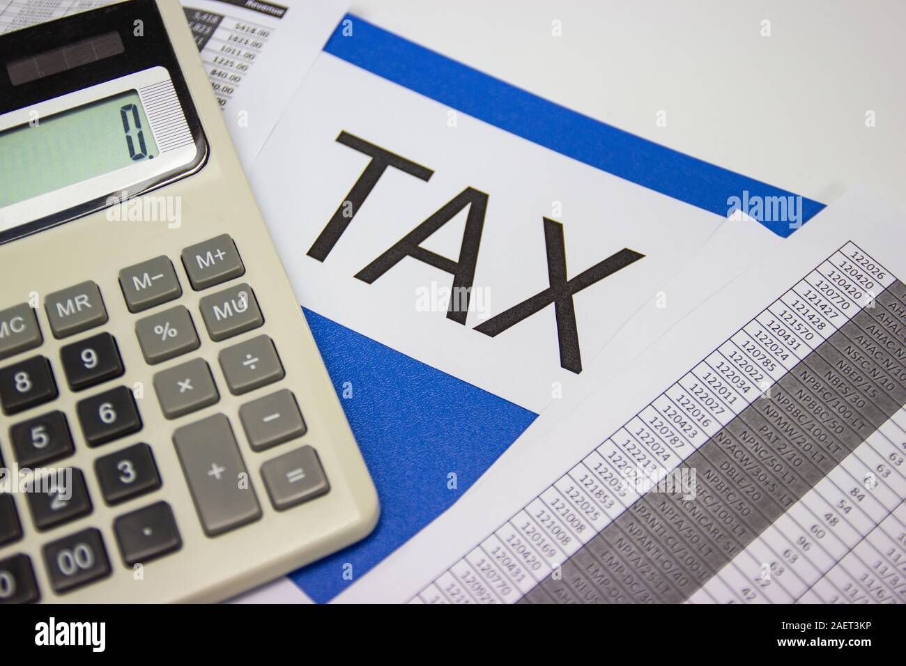 Folder Tax documents and paper files with calculator concept Annual tax ...