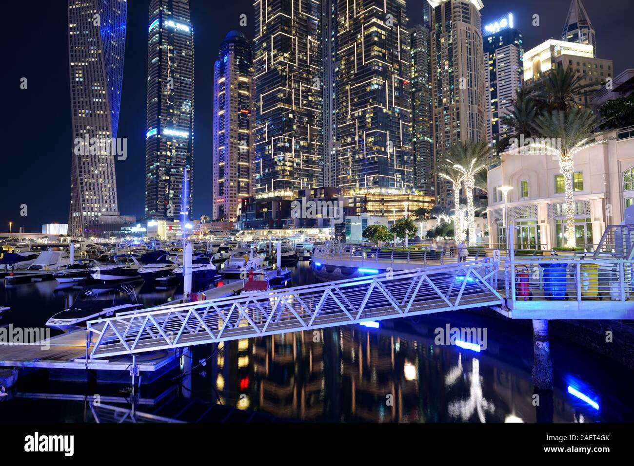 DUBAI, UAE - NOVEMBER 15: The night illumination of Dubai Marina and ... DUBAI, UAE - NOVEMBER 15: The night illumination of Dubai Marina and ...