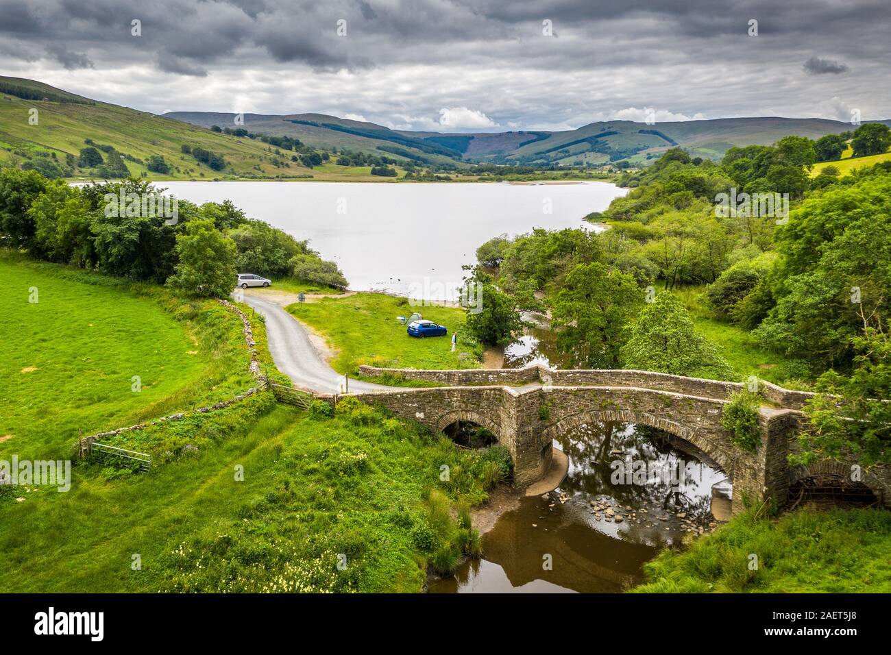 A bridge crossing over a river cutting through the Yorkshire dales ...