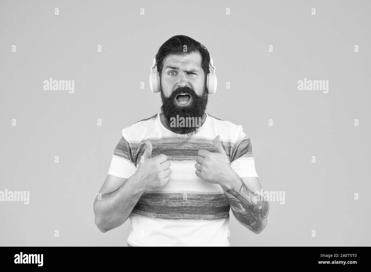 Man in headphones yellow Black and White Stock Photos & Images - Alamy