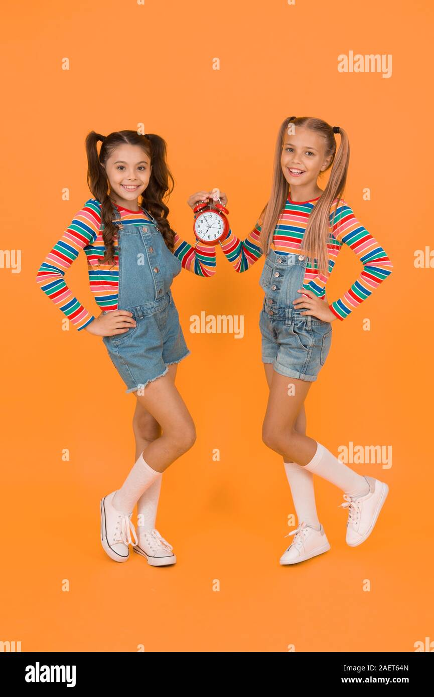 Small children smiling with mechanical clock. School clock. Timing ...