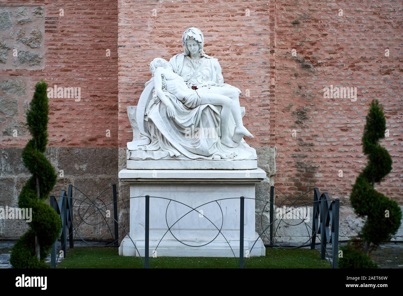 An elaborate memorial in marble featuring a shrouded woman holding a ...