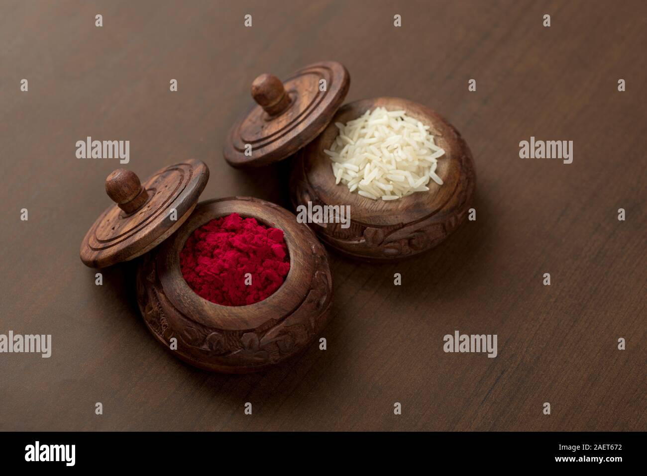 Kumkum and rice grain container. Natural color powders are used while ...