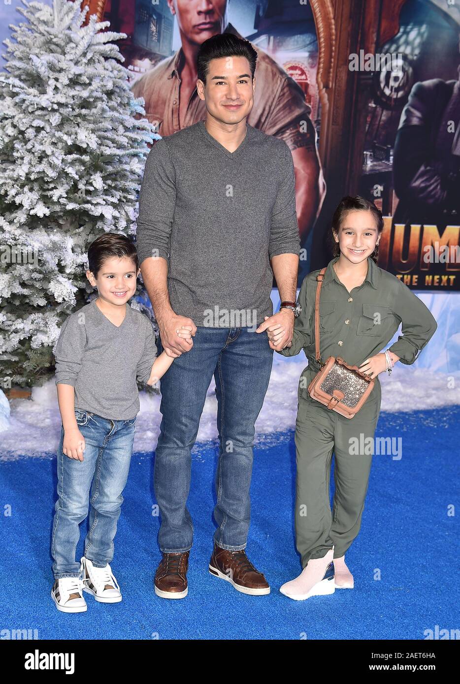 HOLLYWOOD, CA - DECEMBER 09: Mario Lopez (C) and children attend the ...