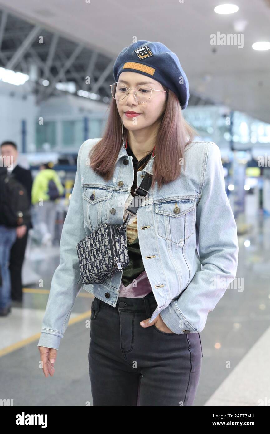 Chinese singer and actress Tan Weiwei arrives at a Beijing airport ...