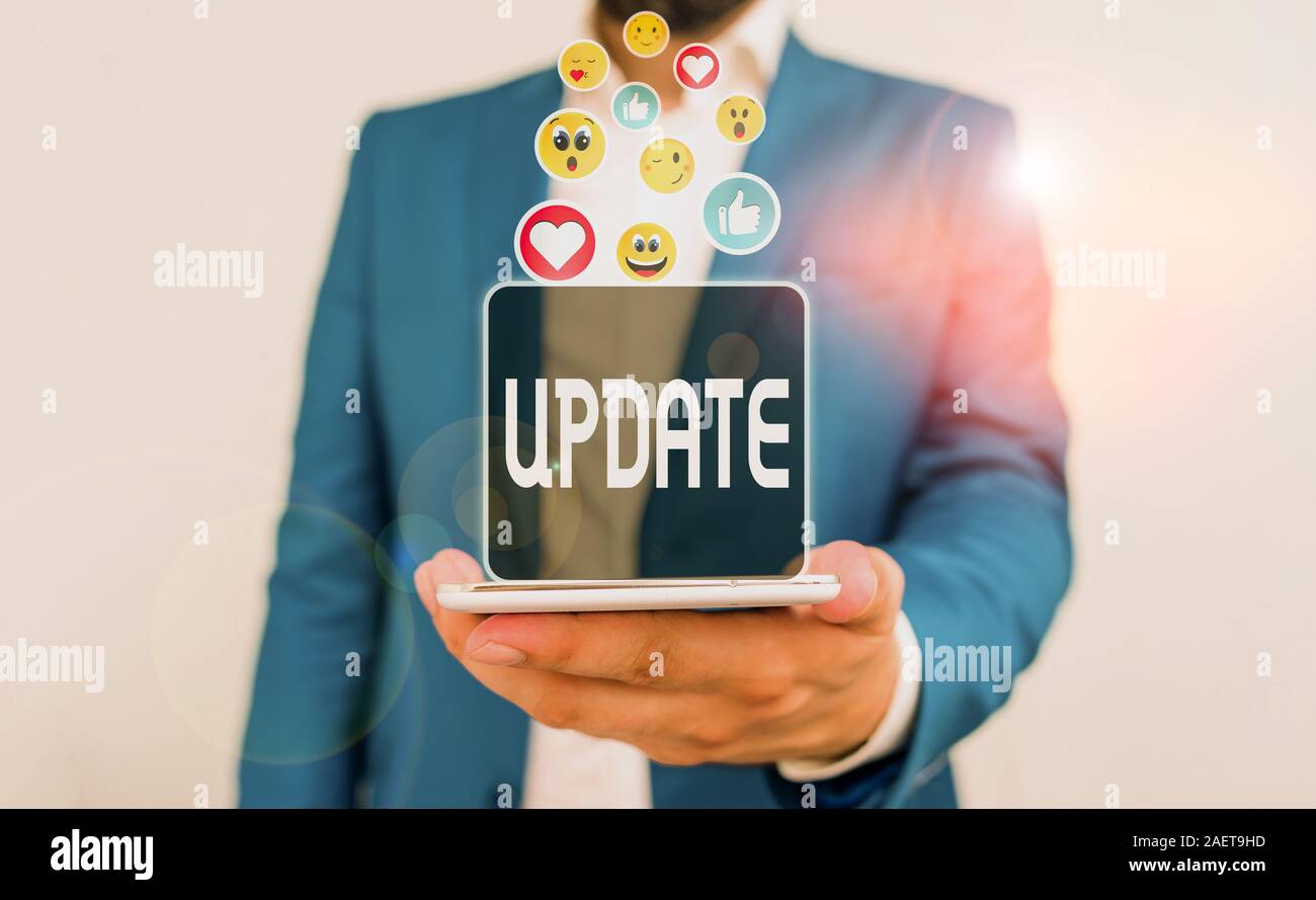 Conceptual hand writing showing Update. Concept meaning make something more modern or up to date ...