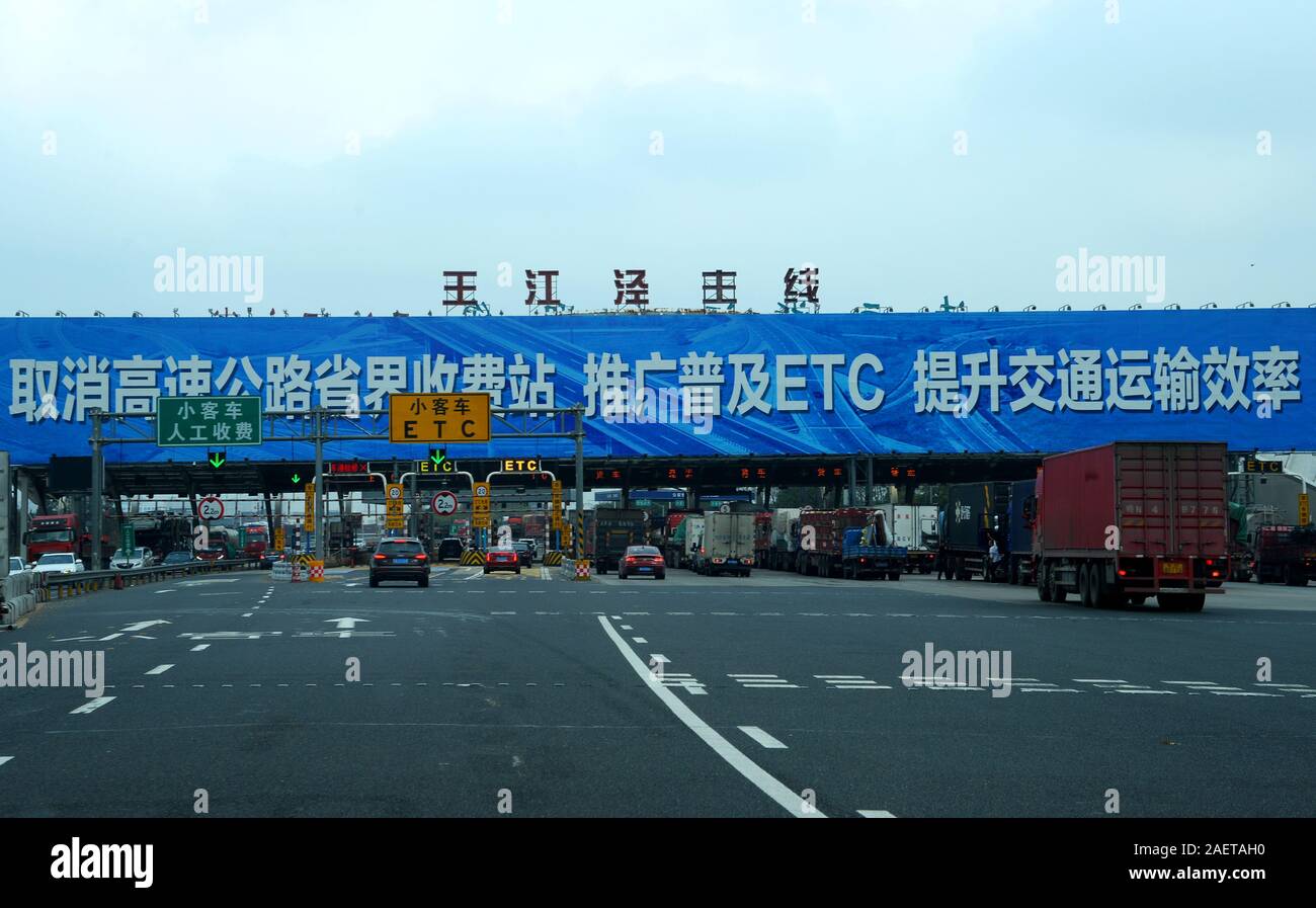 --FILE--Cars pass through toll gate with electronic toll collection ...