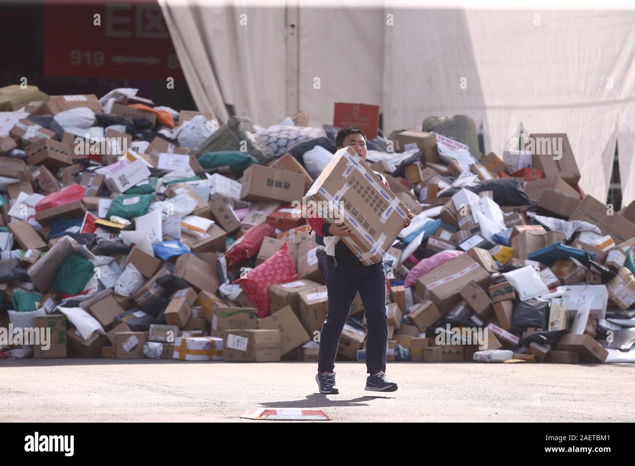 Students carrying parcels, within which there are goods they bought ...