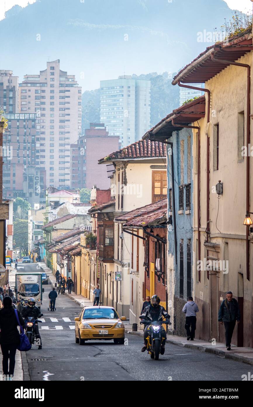 Busy street in Bogot‡ in front of the towering cityscape , Bogot ...