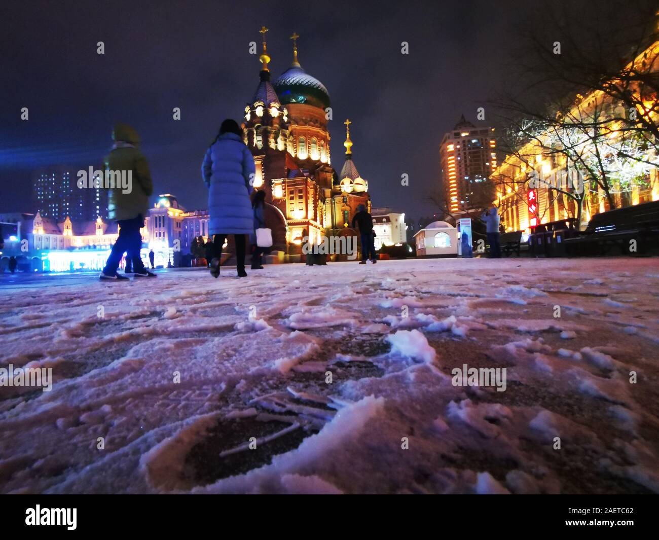 Pedestrians pass by Saint Sophia Cathedral, a local landmark of former ...