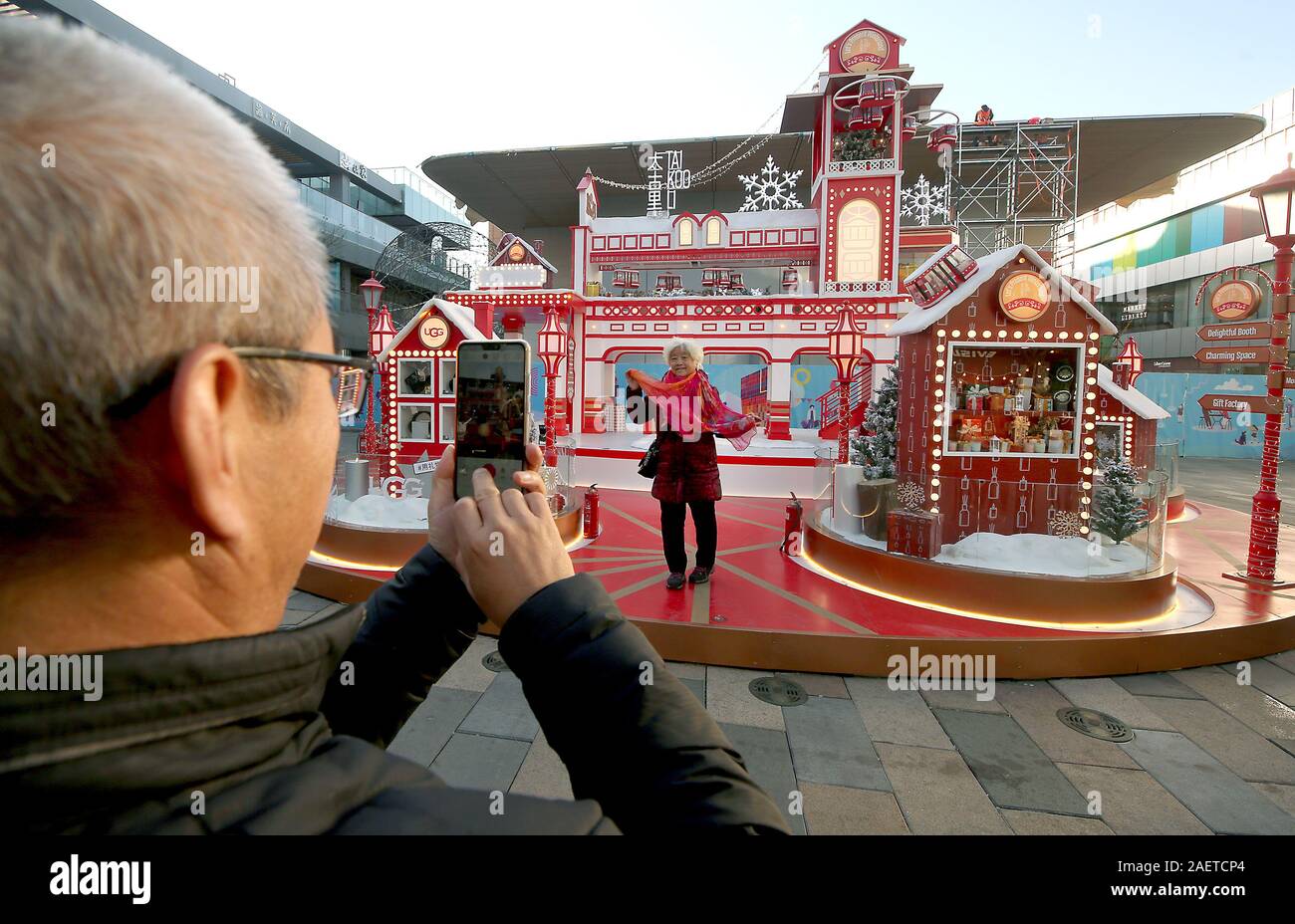 Beijing, China. 10th Dec, 2019. Chinese explore a large Christmas ...