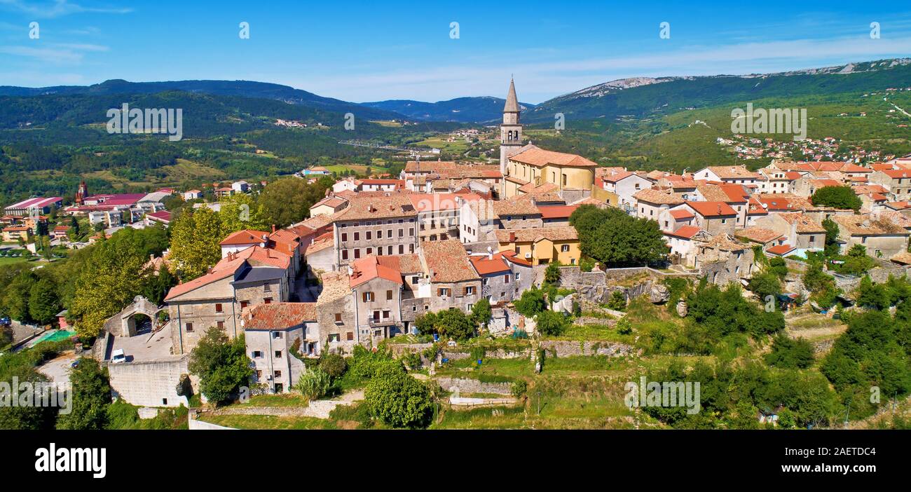 Buzet. Hill town of Buzet surrounded by stone walls in green landscape ...