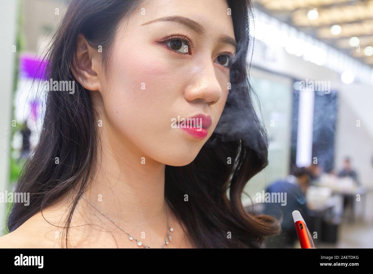 A person vapes at the 2019 Vape Culture Week and IECIE eCig Expo in ...