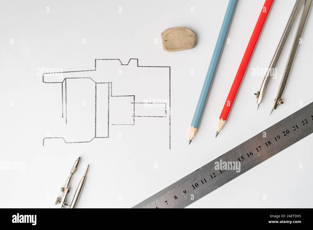 drawing plan on a color surface using the pencil, ruler, compass and ...