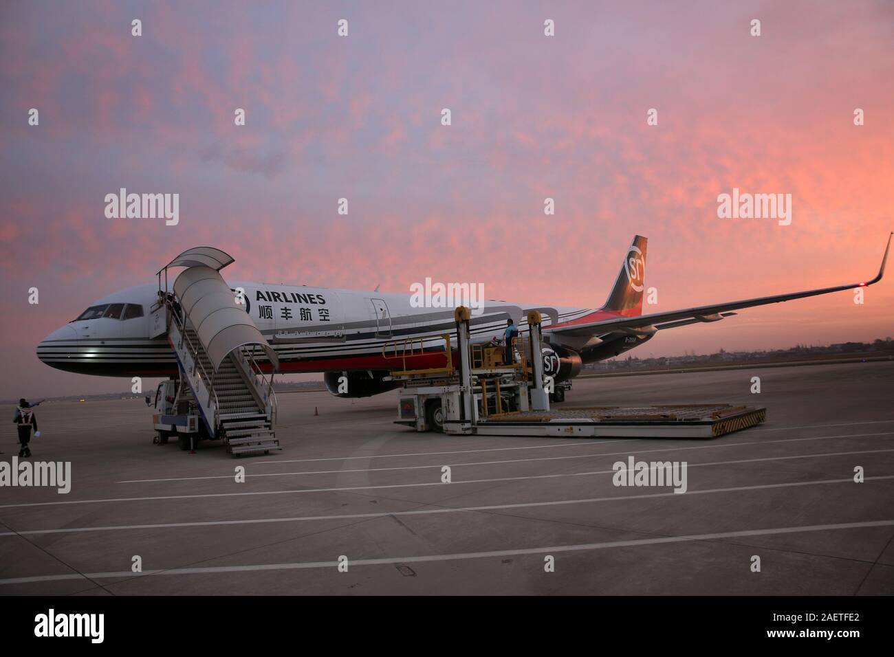 A Tianjin Air Cargo's Boeing 737 that has a SF Express logo on its body ...