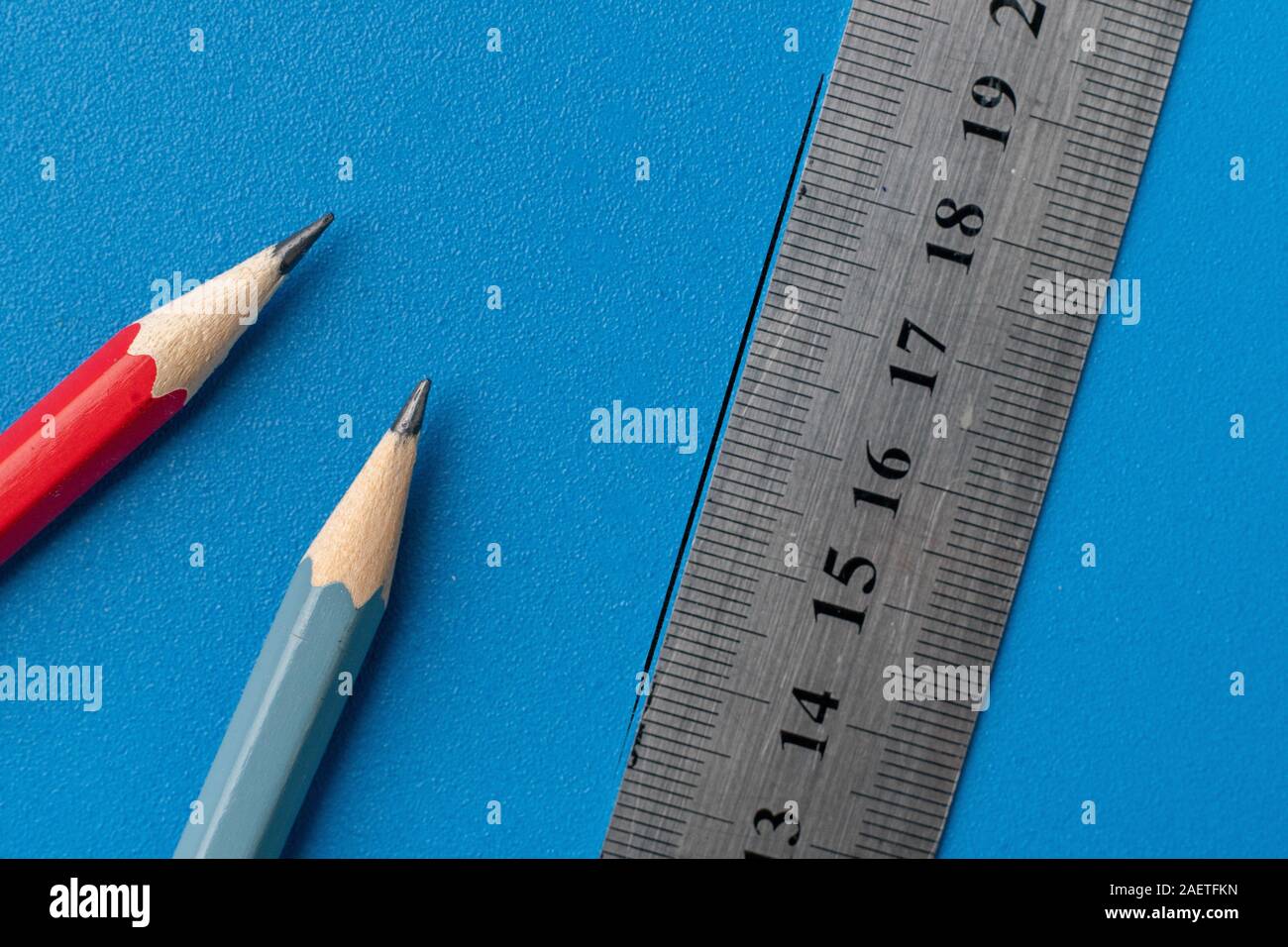 drawing a line on a color surface with a ruler and a pencil Stock Photo ...
