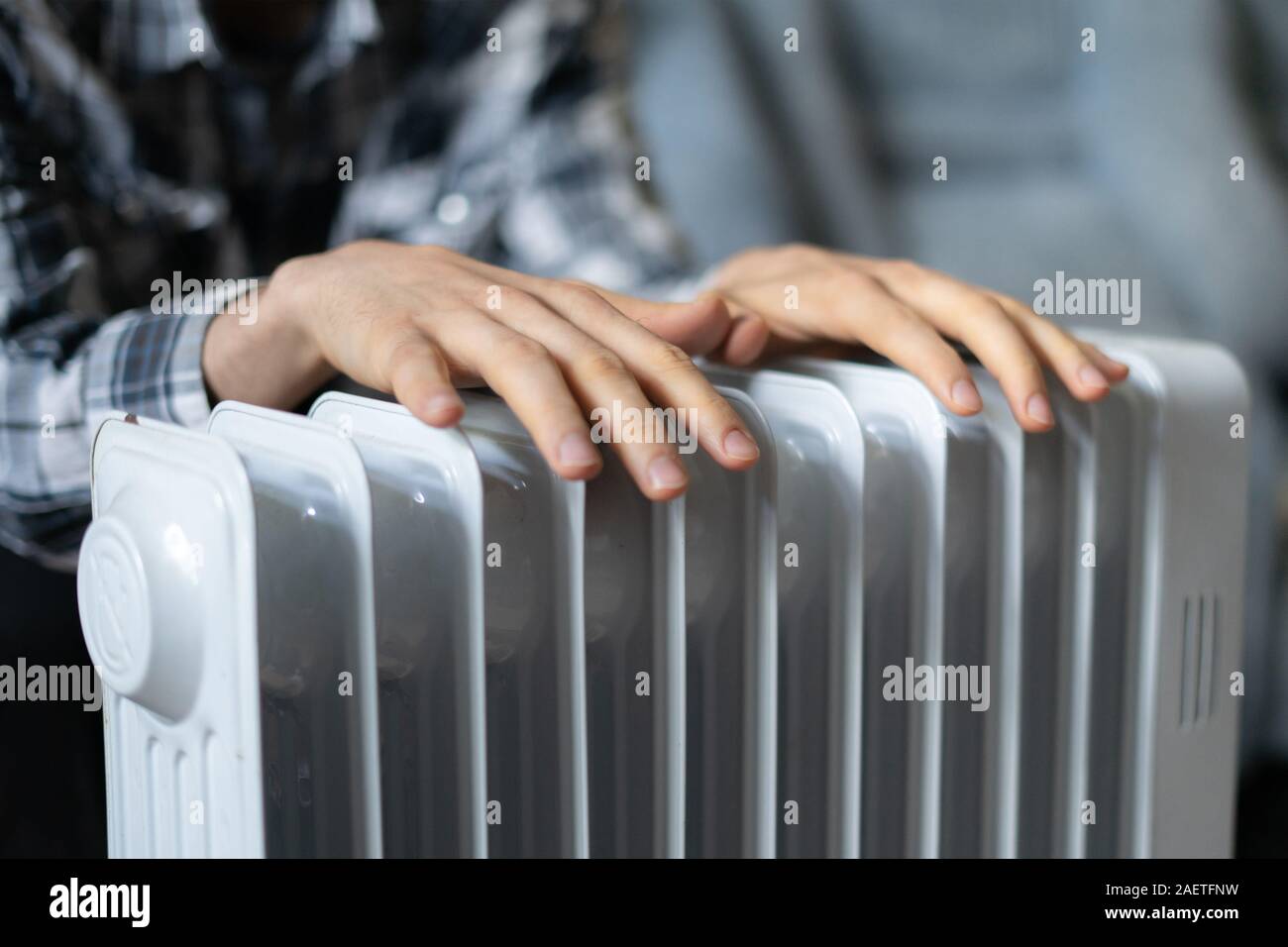 feeling cold, getting warm, hands touching heater close up Stock Photo ...