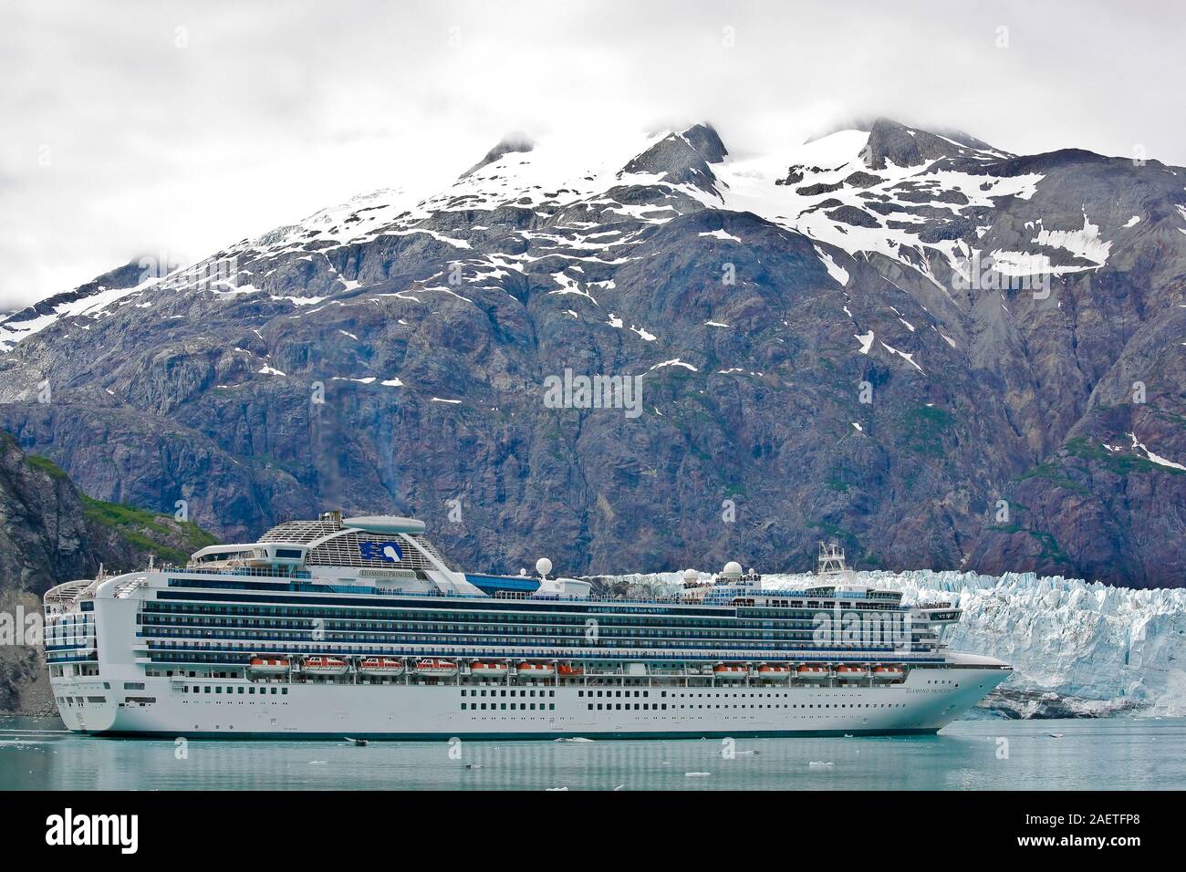Large cruise ship lumbers cautiously toward tidewater glaciers in ...