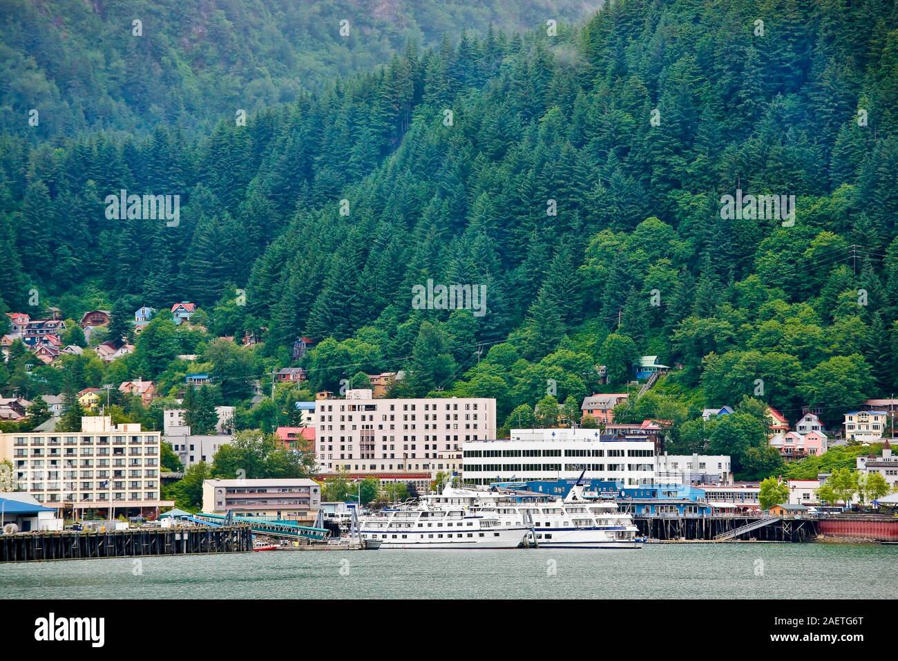 Juneau, AK harbor and pier in Gastineau Channel, with residential homes ...