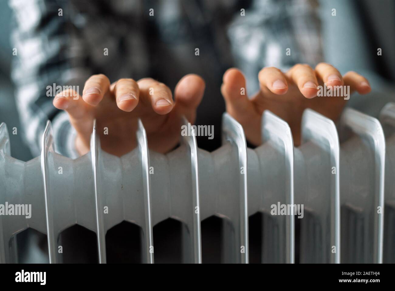 feeling cold, getting warm, hands touching heater close up Stock Photo ...