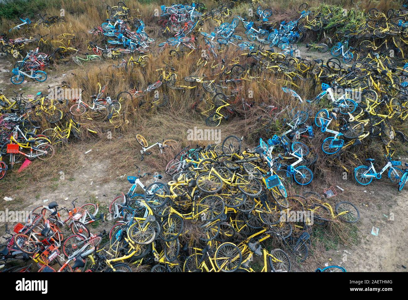 Aerial view of the piles of abandoned and broken bicycles in a suburb ...
