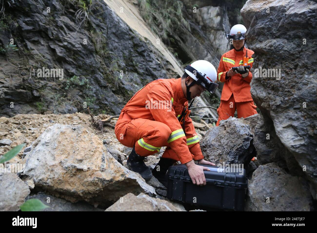 Local firemen remove mud and stones on 319 National Highway after ...
