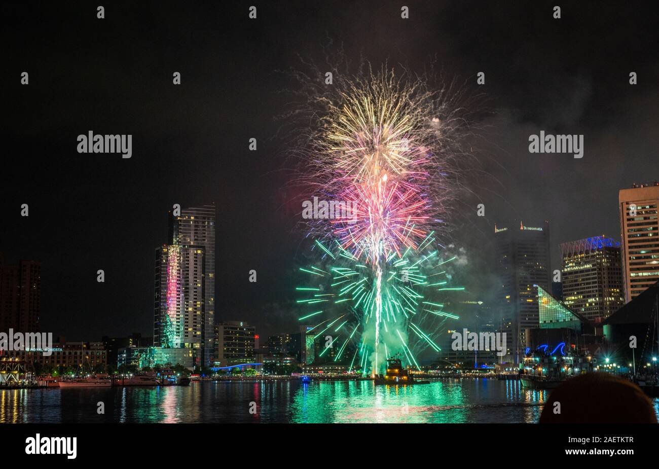 Colorful fireworks light up the night sky over Baltimore's inner harbor ...
