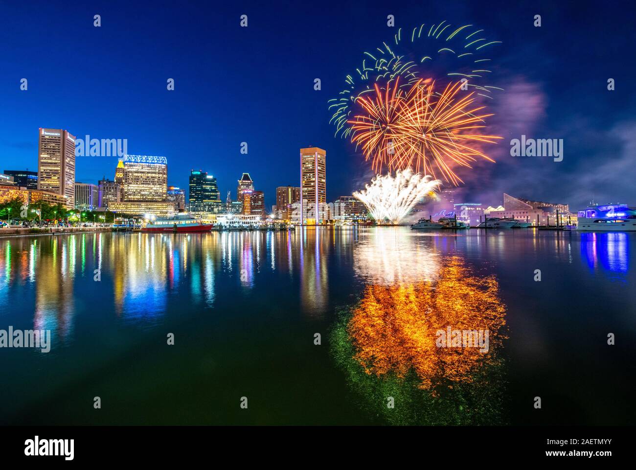 Colorful fireworks light up the night sky over Baltimore's inner harbor ...
