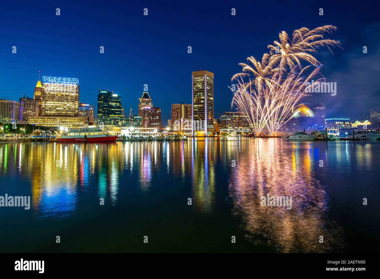 Colorful fireworks light up the night sky over Baltimore's inner harbor ...