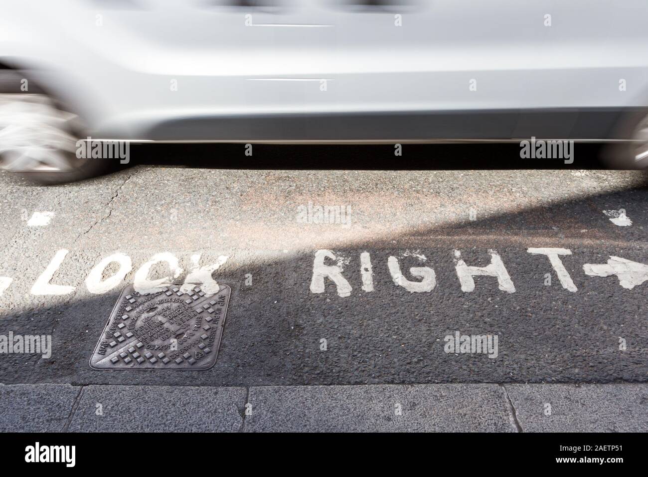 markings on the pavement instructing pedestrians to look right before ...