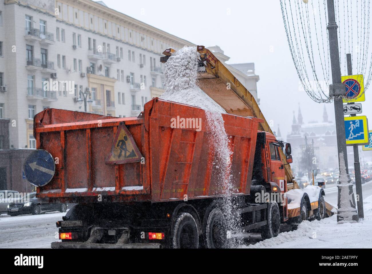 the city snow cleaning service department at work in the public streets ...