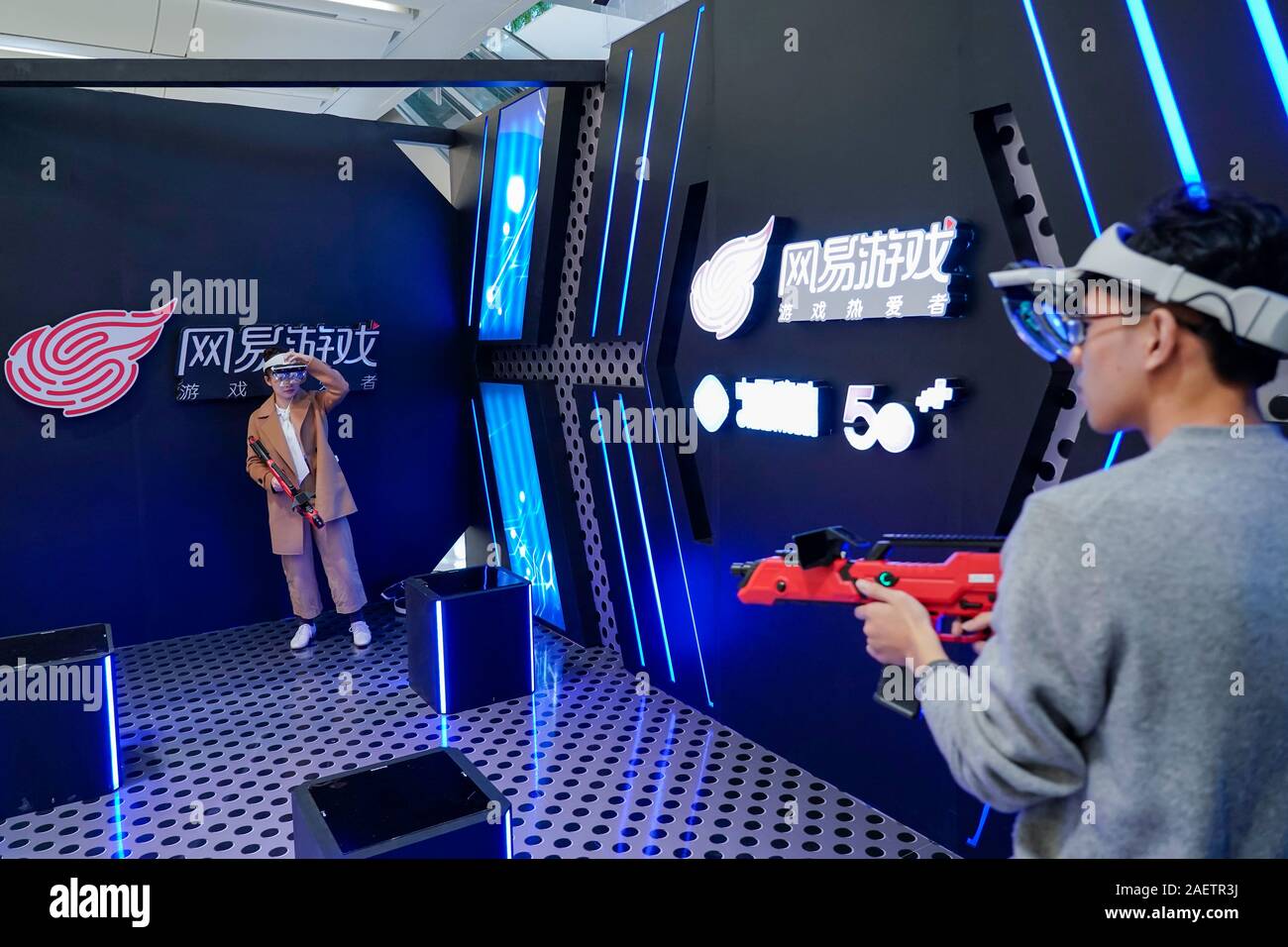 Visitors experiene NetEase 5G games at the 2019 NetEase Future ...