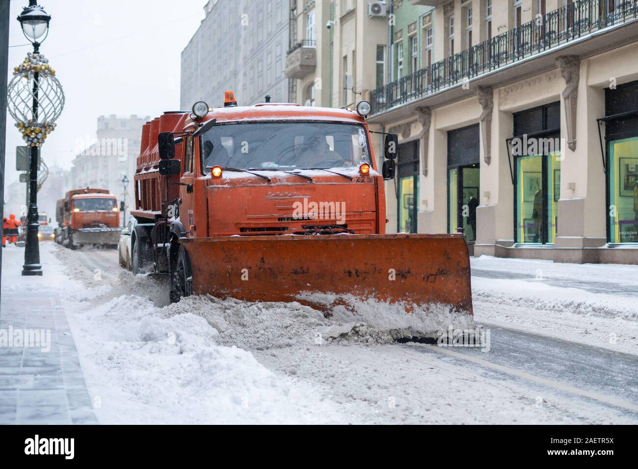 the city snow cleaning service department at work in the public streets ...