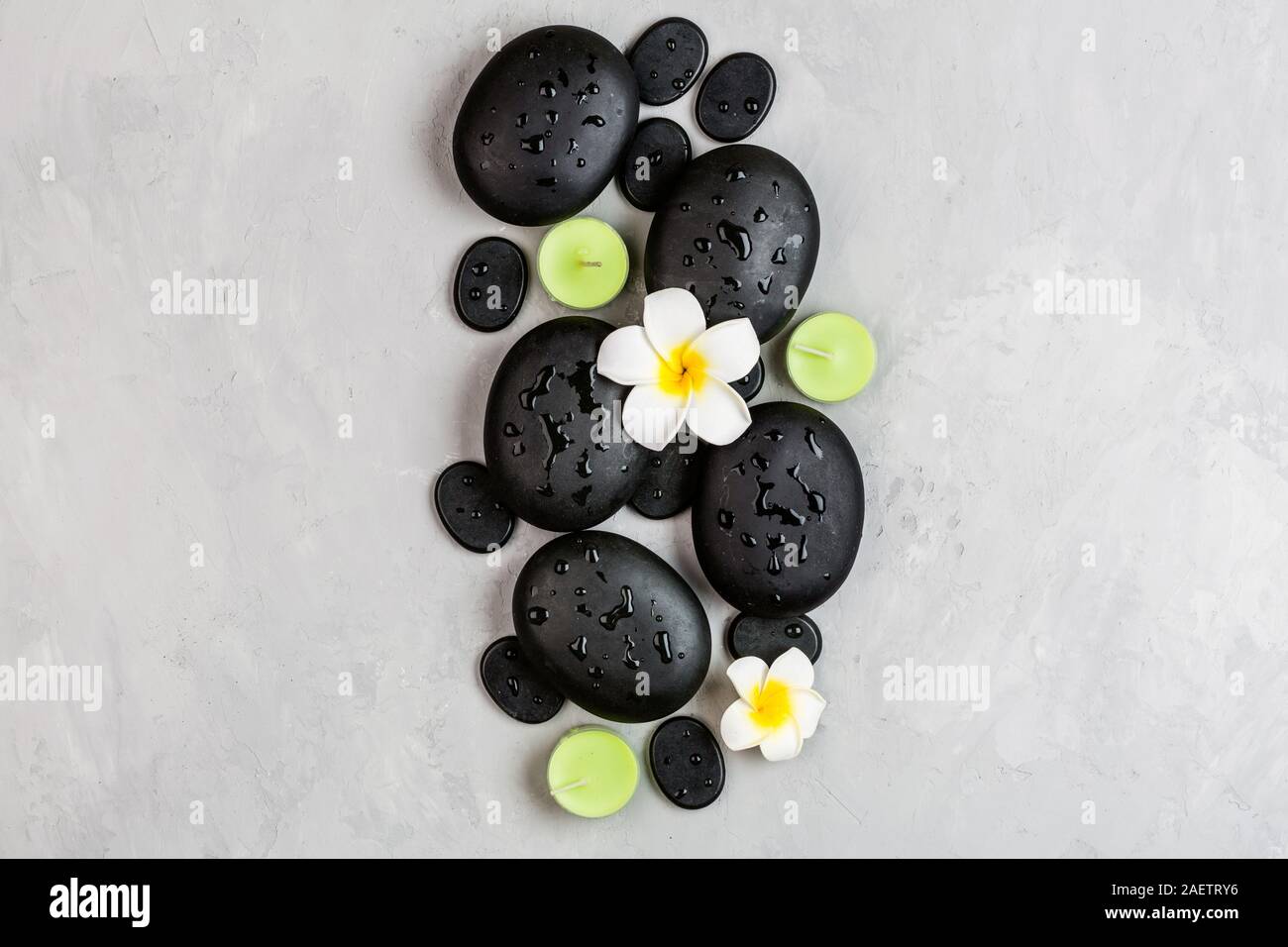 Top view of hot spa stones set for massage treatment and bamboo on ...