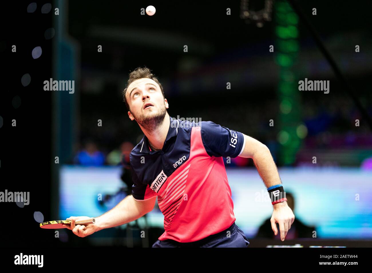 Gauzy Simon of France gets the ball against Ma Long of China (not ...