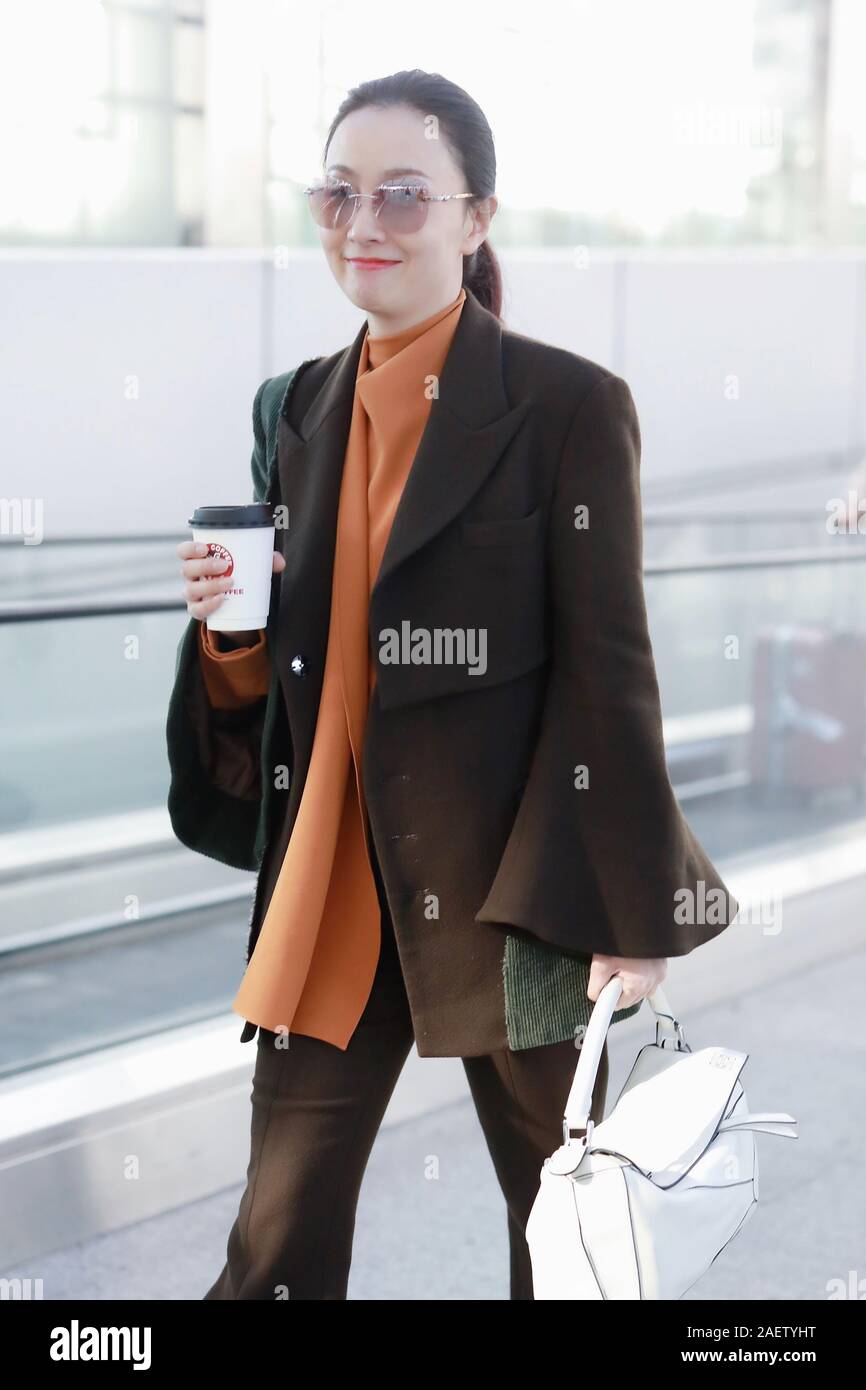 Chinese actress Tao Hong or Helen Tao arrives at a Beijing airport in Beijing, China, 25 ...