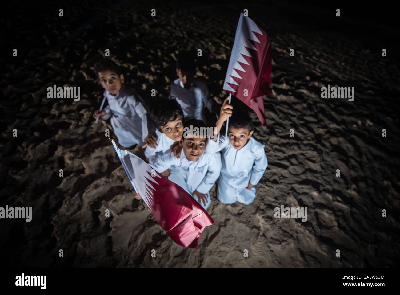 Kids with Qatar Flag Stock Photo - Alamy