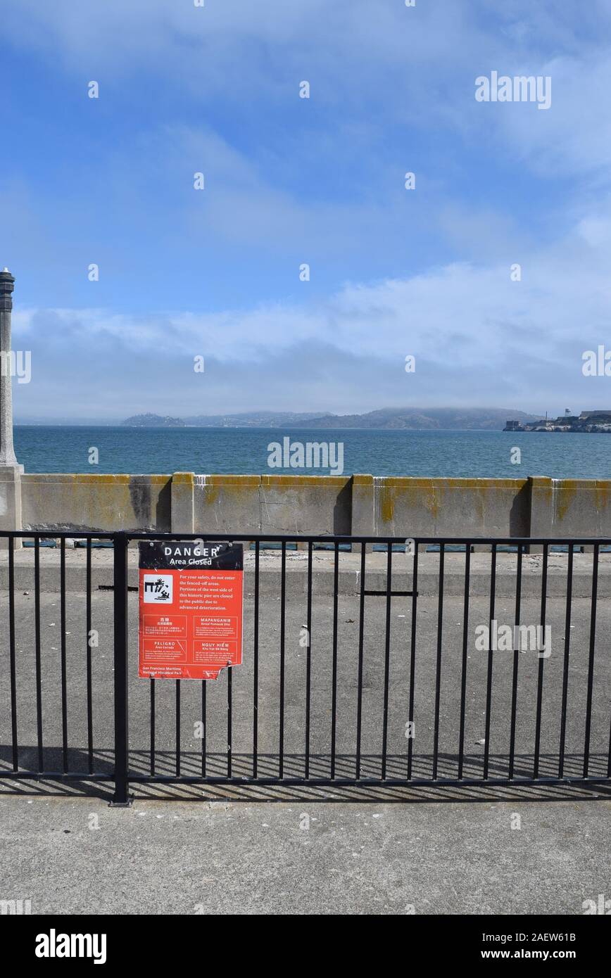 Warning sign on Municipal Pier, San Francisco. The structure is in dire ...