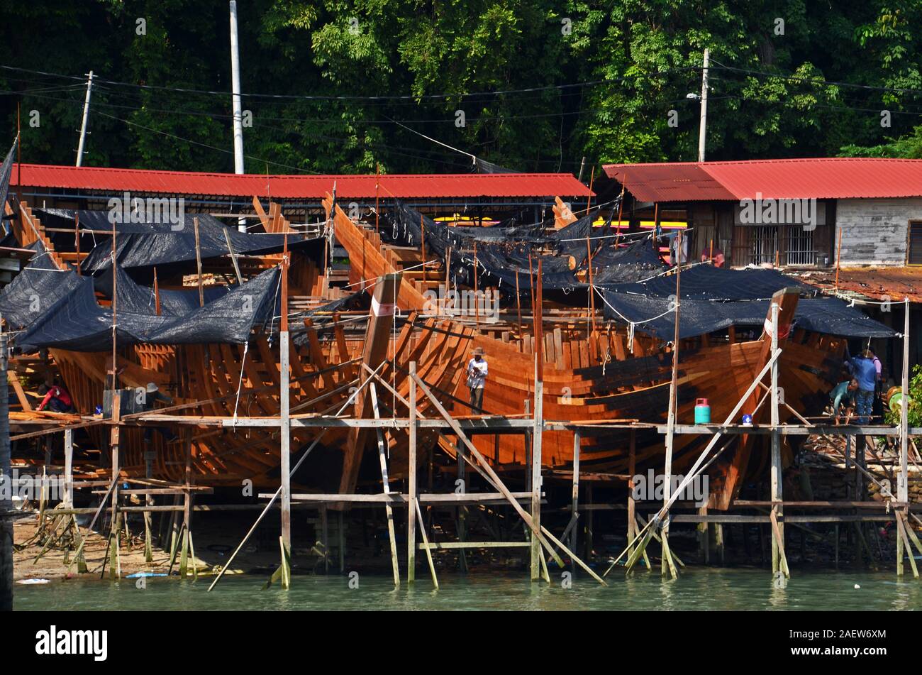 A fishing boat under construction in a shipyard on Pangkor Island ...