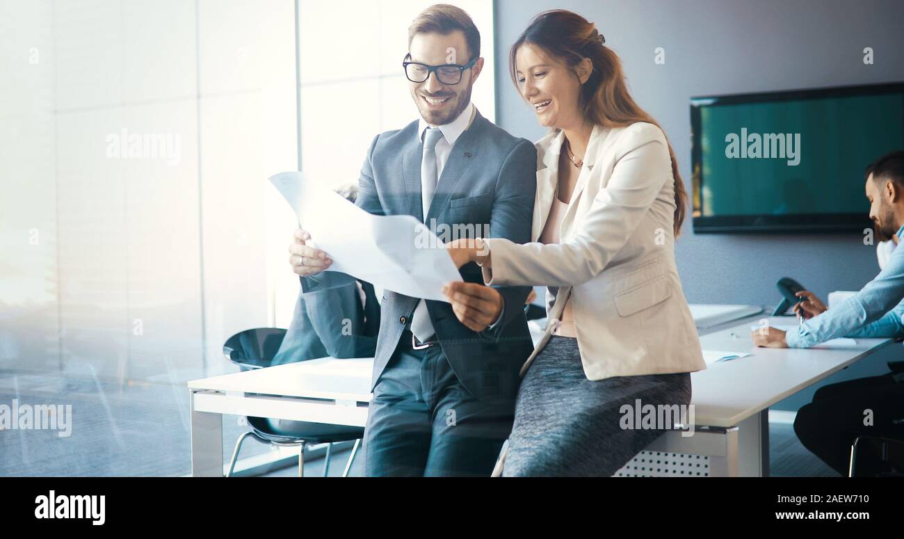 Business people sitting around table hi-res stock photography and ...