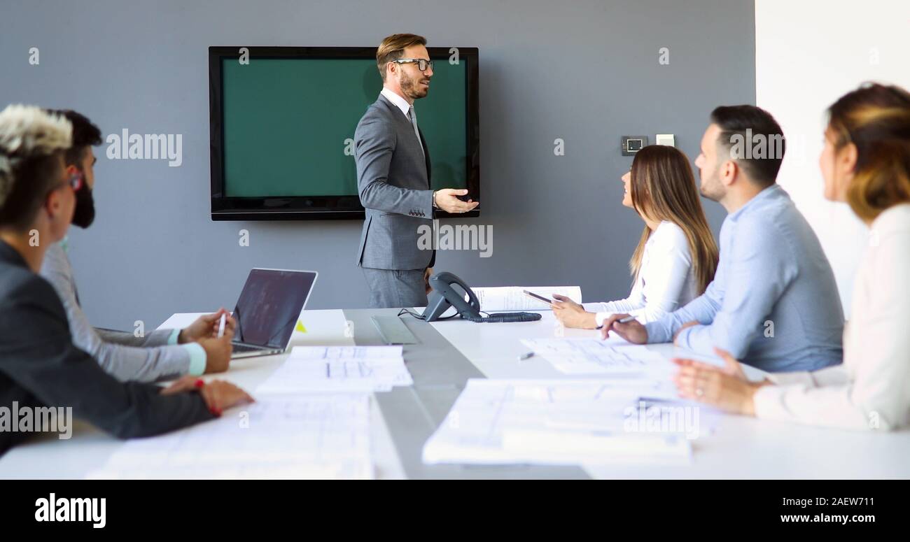 Perspective businesspeople having meeting in conference room Stock ...