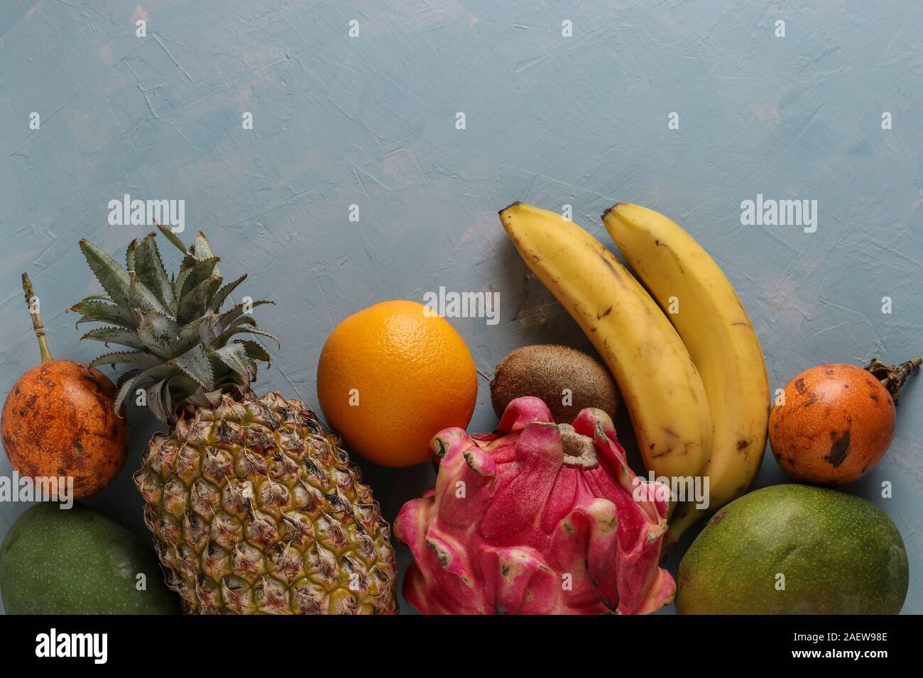 Fresh tropical fruits: mango, pineapple, dragon, kiwi, banana, orange ...